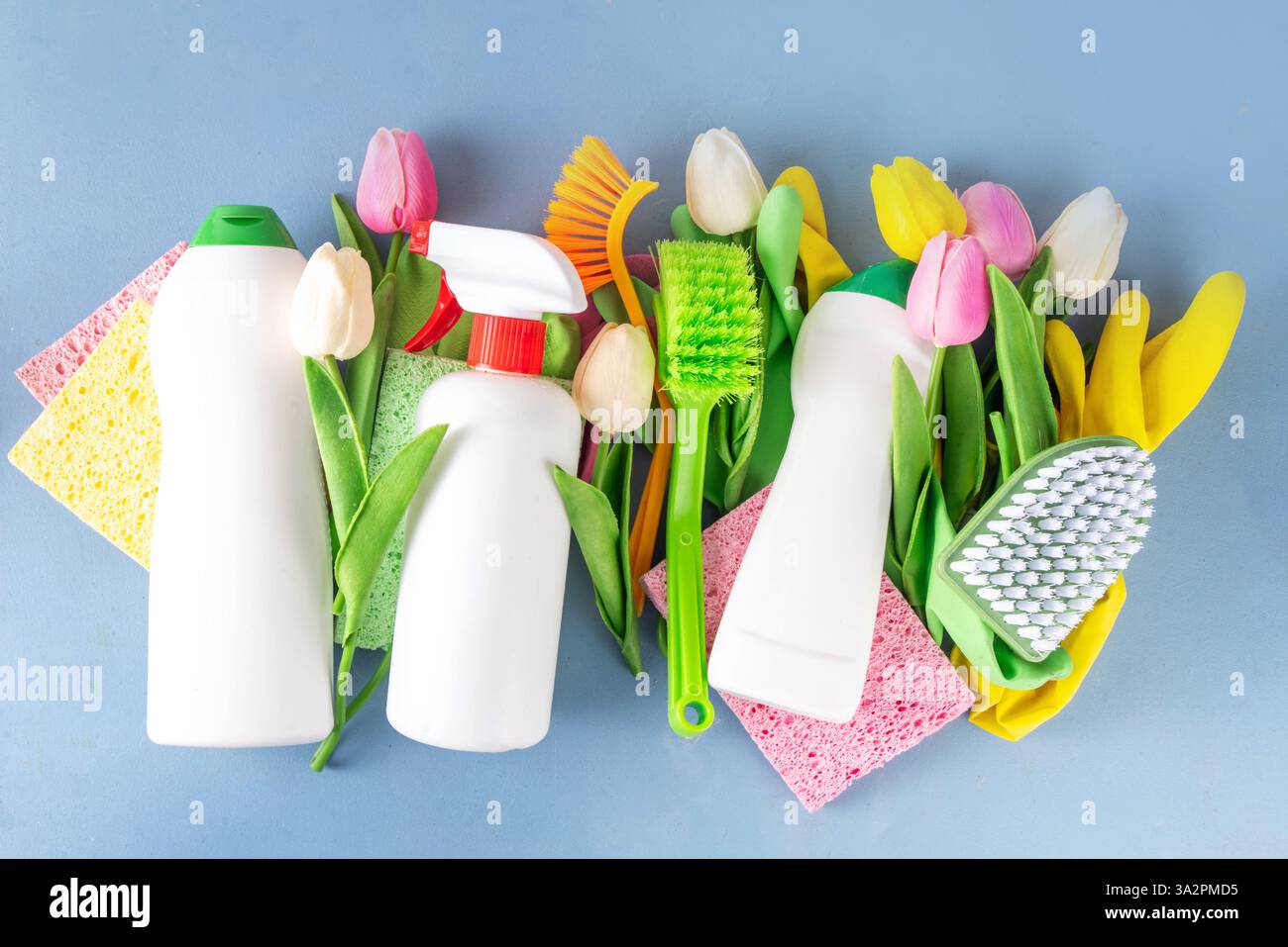 Colorful creative Spring cleaning background, with a bouquet with ...
