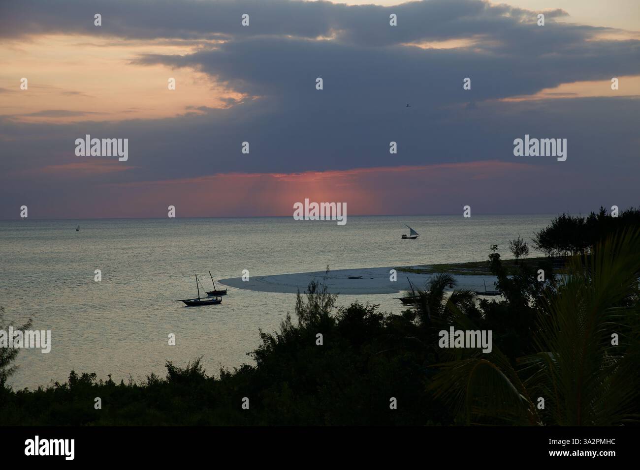 Serene sunset over the Indian Ocean, Zanzibar, Tanzania. Traditional ...