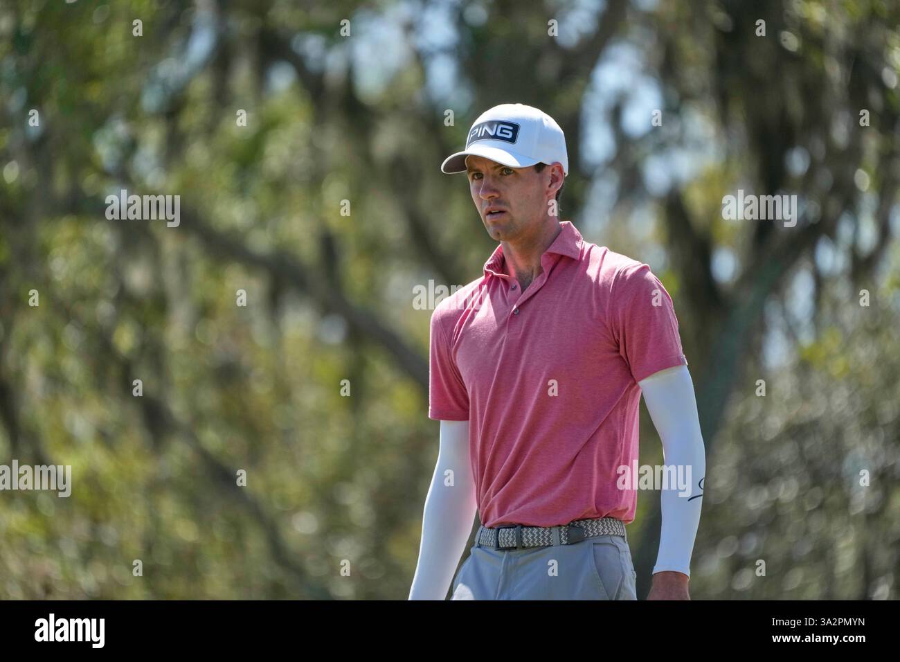 Alex Smalley walks across the ninth green during the first round of The ...