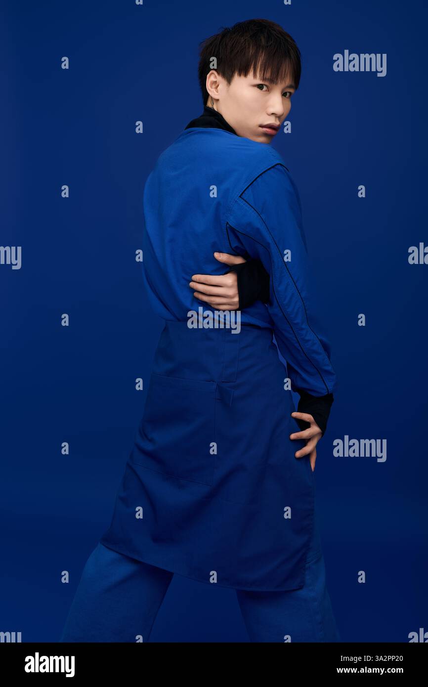 Stylish young Asian man in blue exudes confidence and charisma with his ...