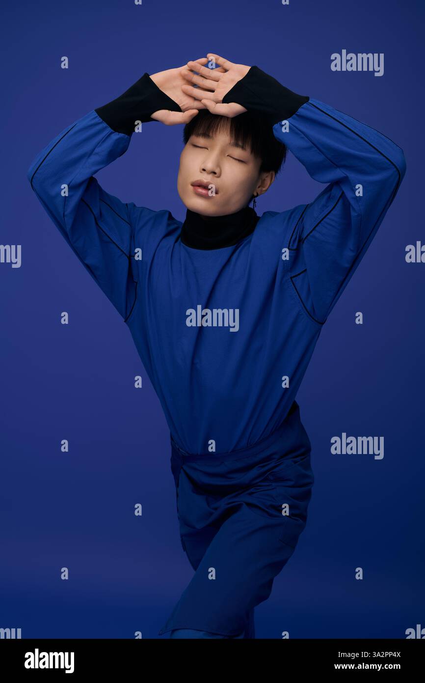 Striking young asian man showcases his fashion sense and artistic ...
