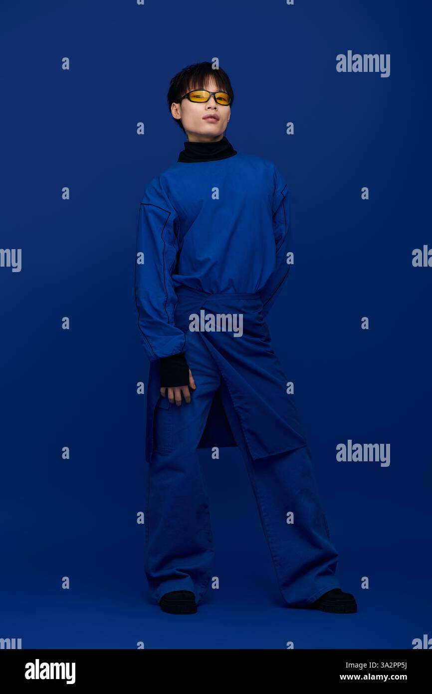 A young handsome Asian man exudes confidence while posing in a vibrant ...
