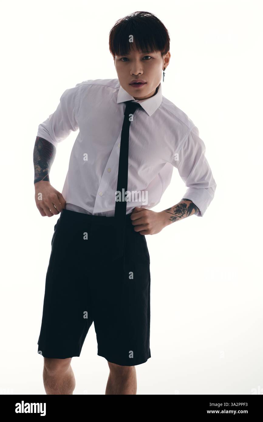 Captivating young man showcases modern fashion with a confident pose ...