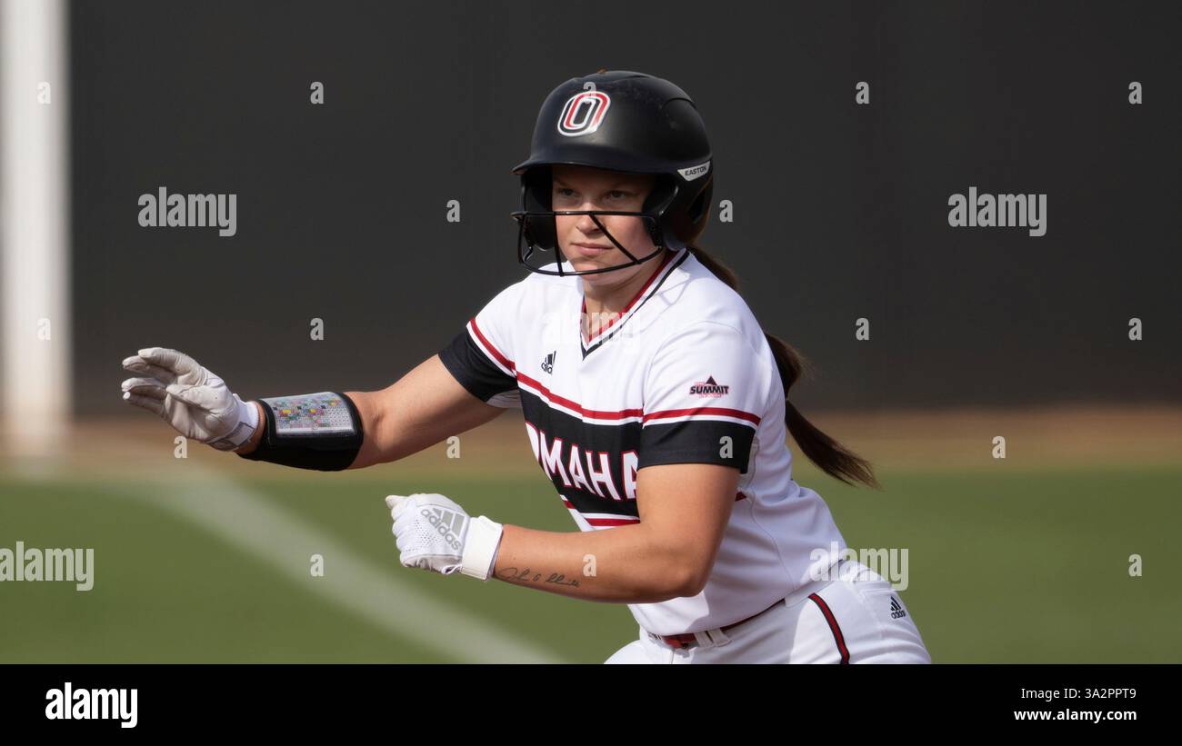 Omaha's Sammy Schmidt takes a lead during an NCAA softball game against ...