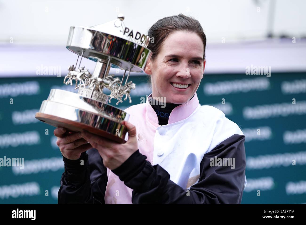 Rachael Blackmore celebrates with the trophy after winning the Paddy ...