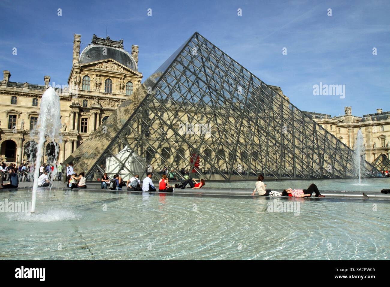 The Louvre Pyramid and fountains in Paris Stock Photo - Alamy