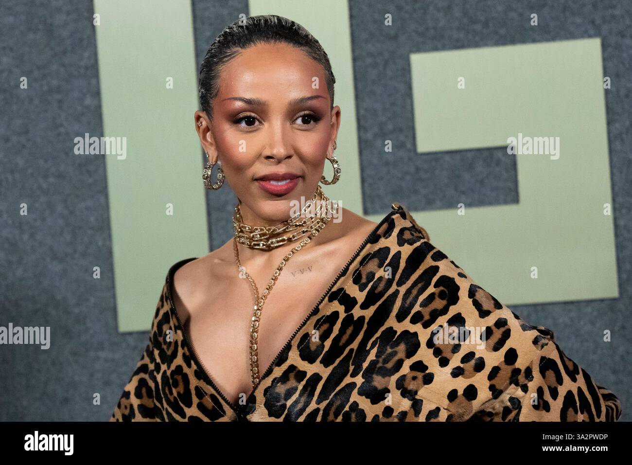 Doja Cat poses for photographers at the photo call for the Balmain Fall ...