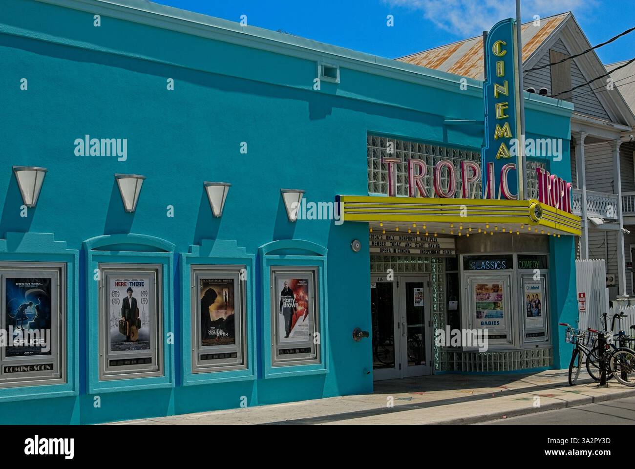 Art Deco designed Tropic Cinema with marquee, row of film posters — Key ...