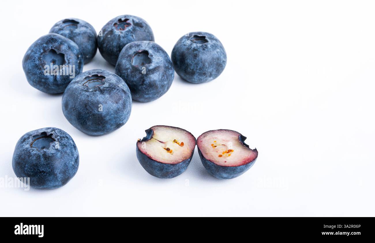 Fresh blueberry cut in half on white background. Close-up Stock Photo ...