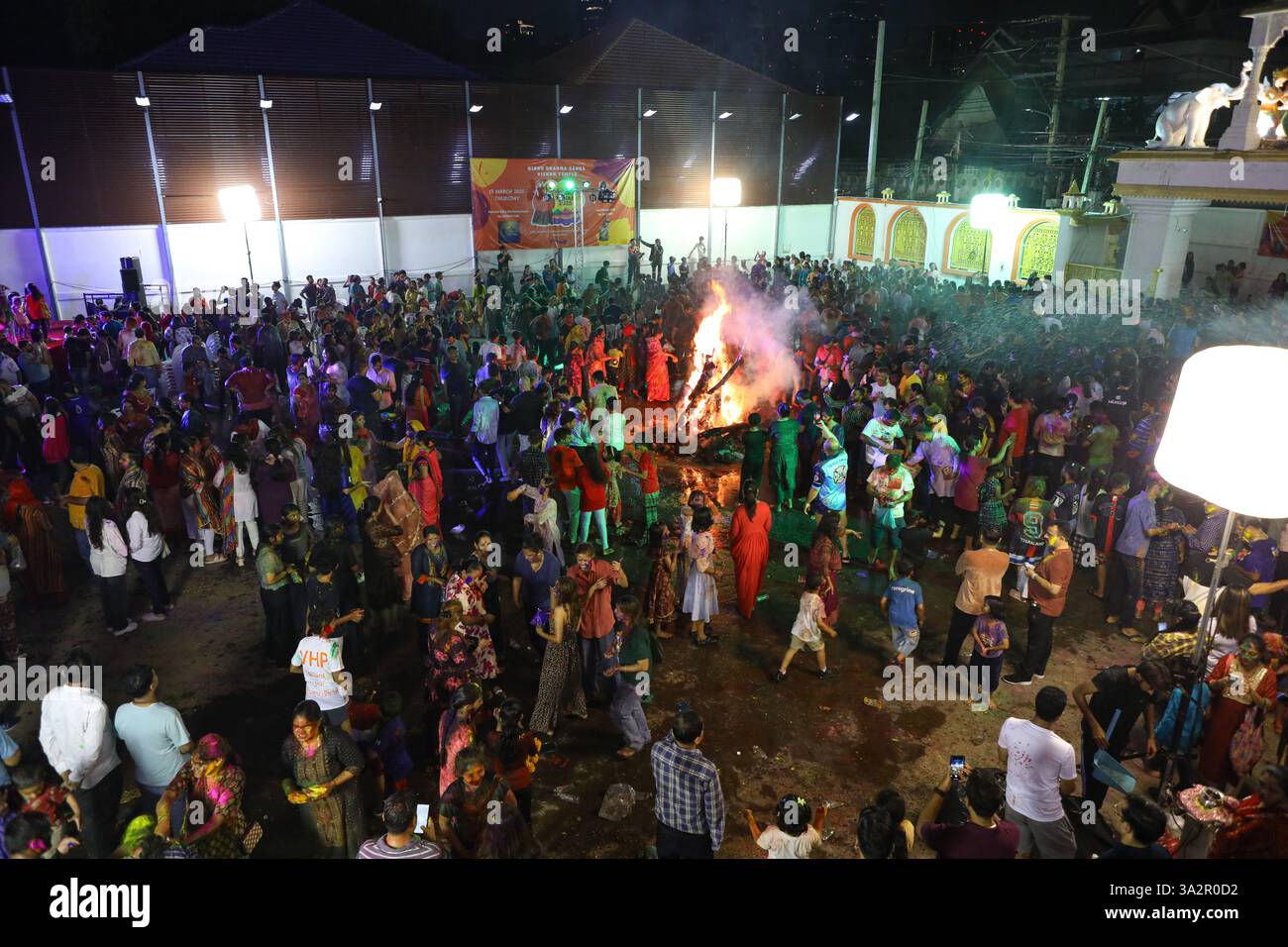 Bangkok, Thailand. 13th Mar, 2025. People dance and throw brightly ...