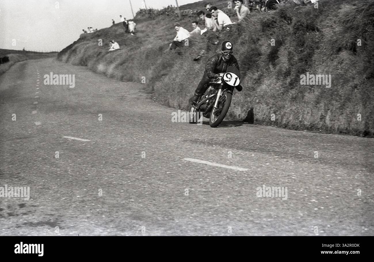 1955, historical, a bike rider on the hill side circuit of the Isle of Man TT race, a three leaf ...
