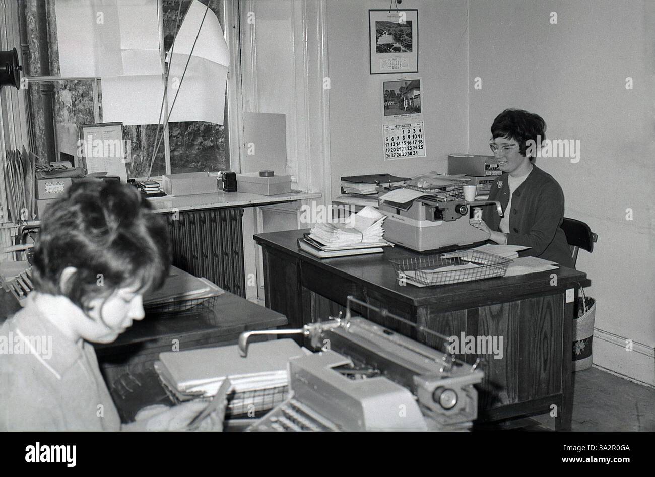 1967, historical, two females working inside an office of shipping ...