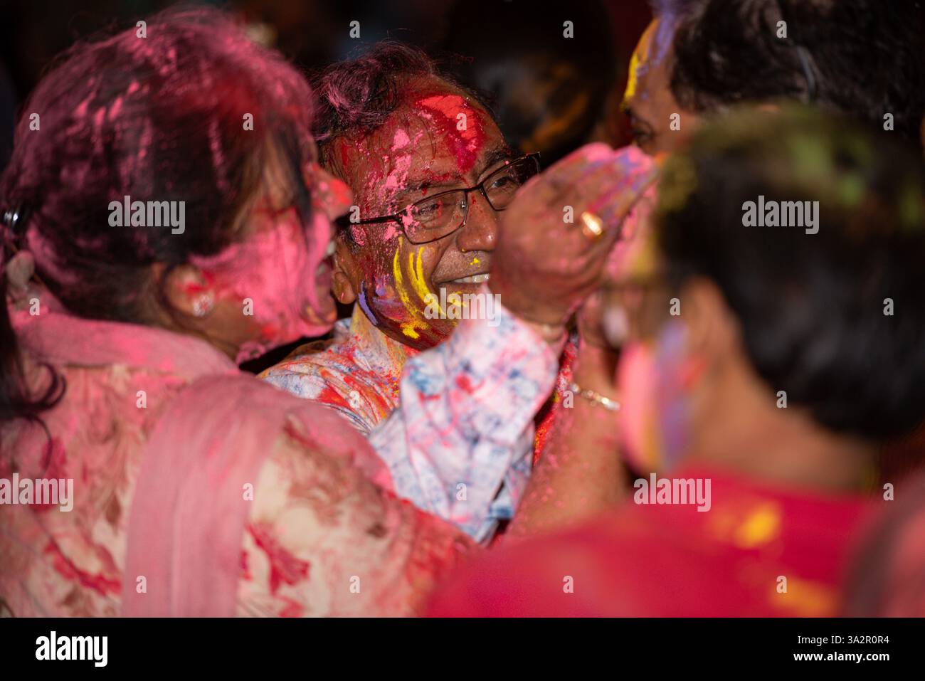 Bangkok, Thailand. 13th Mar, 2025. People dance and throw brightly ...