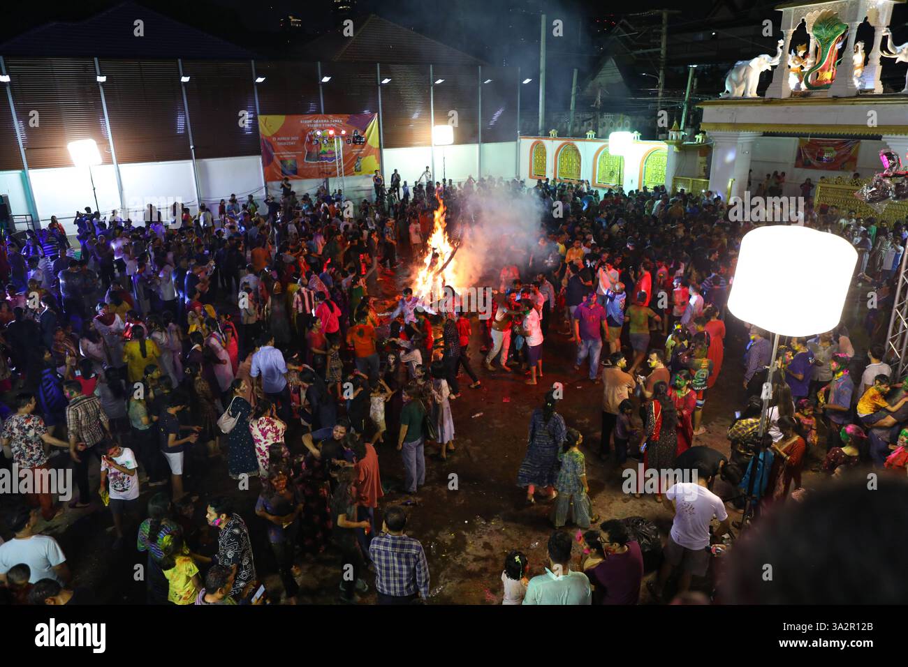 Bangkok, Thailand. 13th Mar, 2025. People dance and throw brightly ...