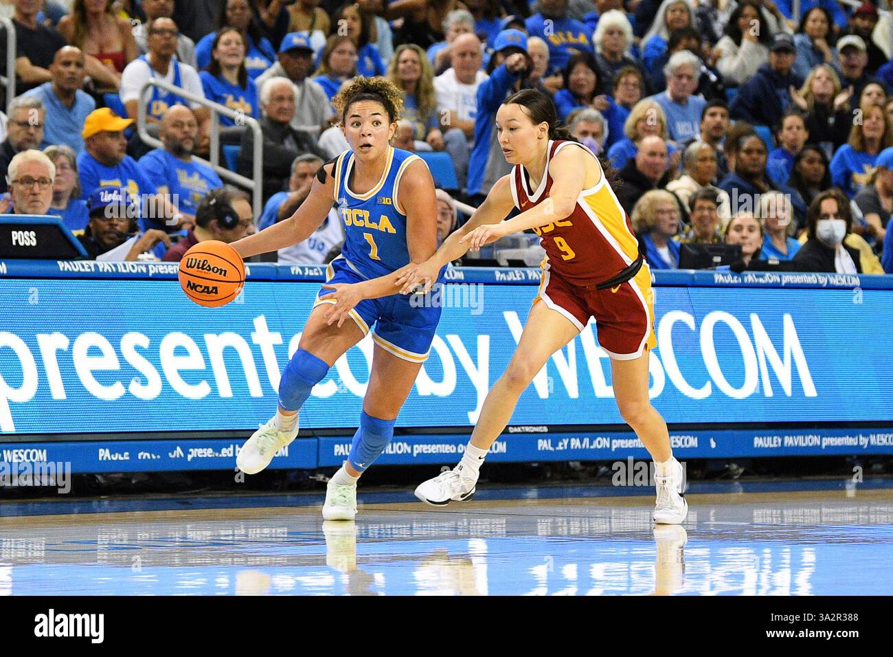 LOS ANGELES, CA - MARCH 01: UCLA Bruins guard Kiki Rice (1) drives past ...