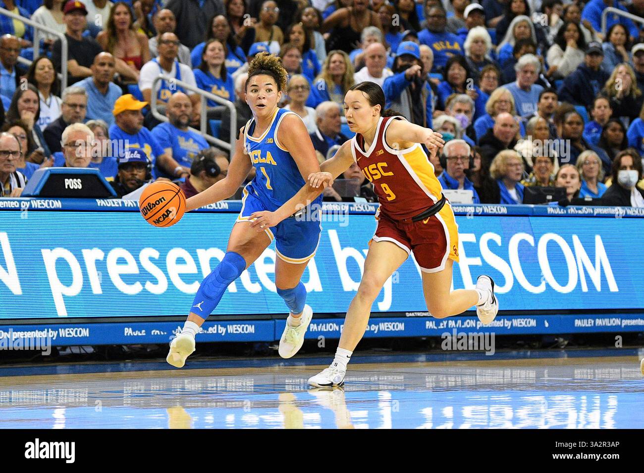 LOS ANGELES, CA - MARCH 01: UCLA Bruins guard Kiki Rice (1) drives past ...