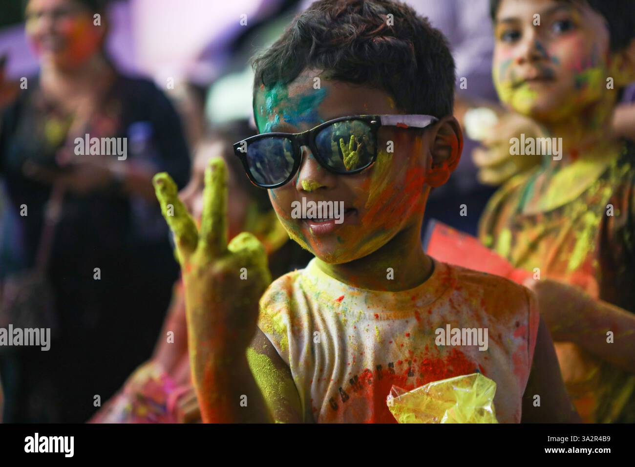Bangkok, Thailand. 13th Mar, 2025. People dance and throw brightly ...