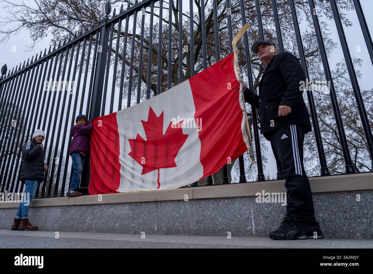 Toronto residents Douglas Bloomfield, from right, his son Phoenix and ...