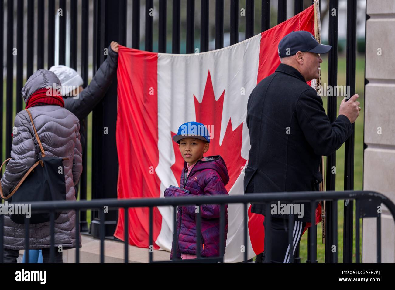 Toronto residents Douglas Bloomfield, from right, his son Phoenix and ...