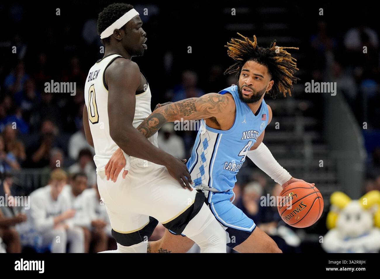 North Carolina guard RJ Davis drives to the basket past Wake Forest ...