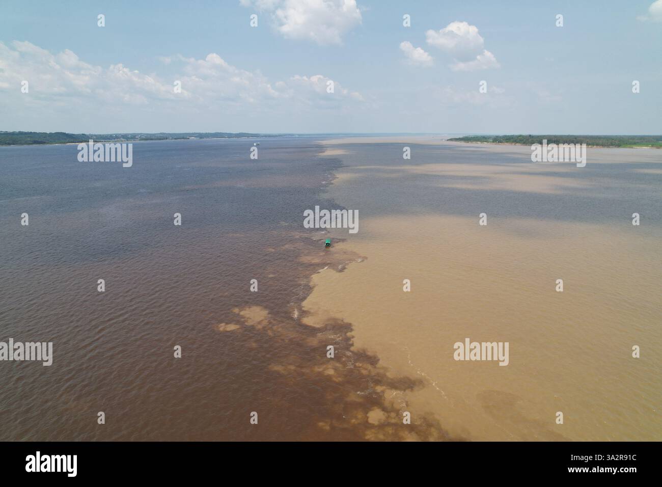 Division of two river waters seen from aerial view in South America ...