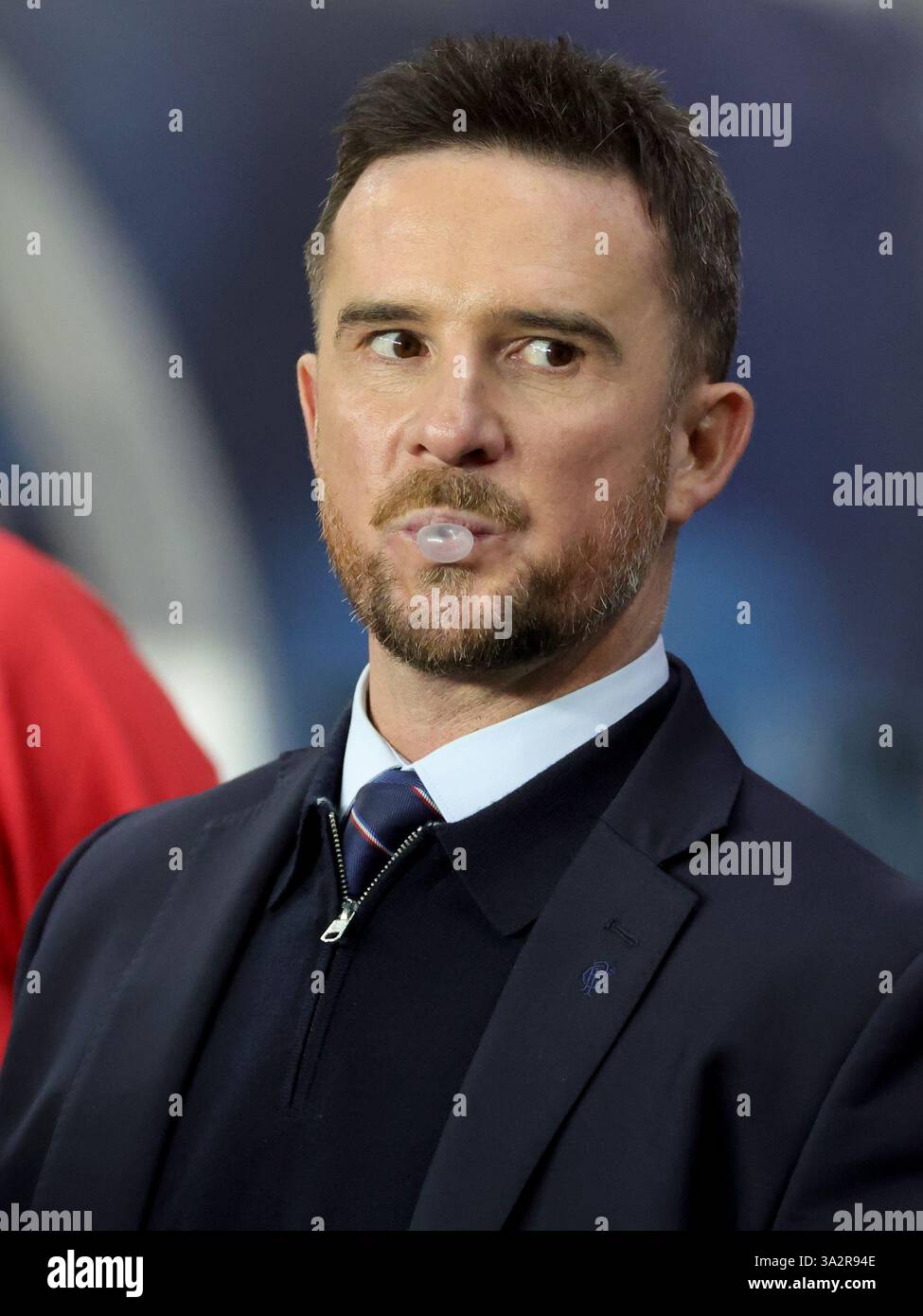 Rangers interim head coach Barry Ferguson blows a bubble while chewing ...