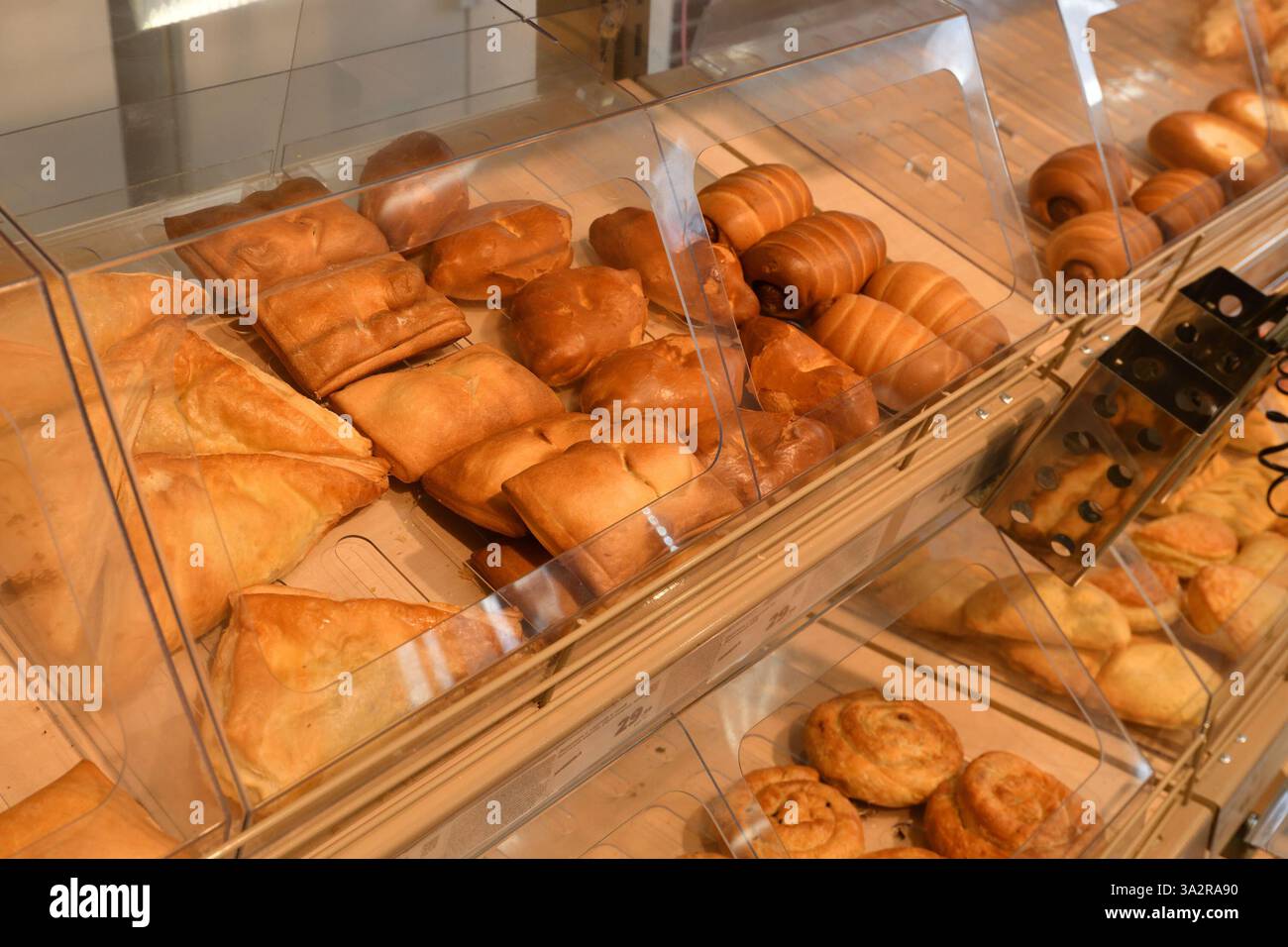Pies and sweet pastries on display at a bakery Stock Photo - Alamy