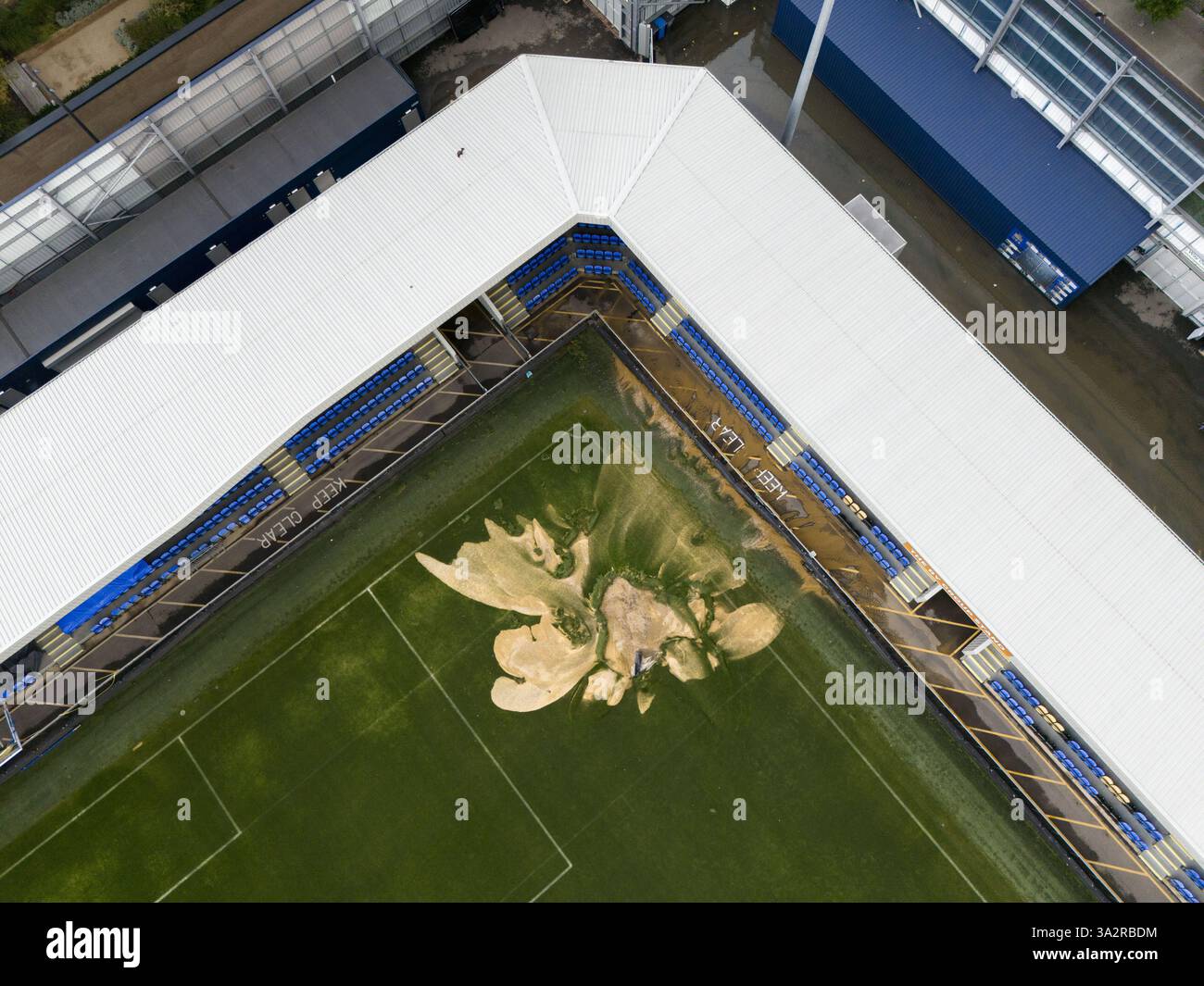 A sinkhole on the pitch and flooded walkways at the Cherry Red Records ...