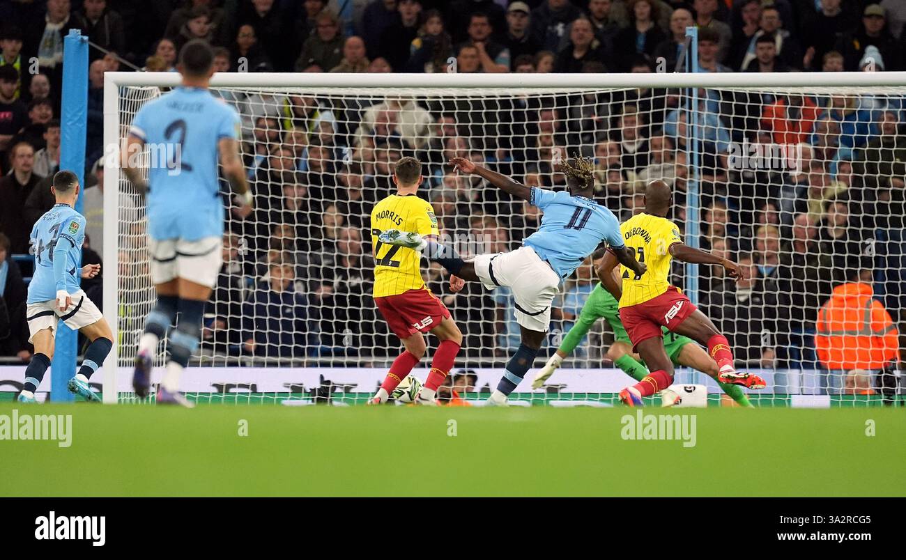 Manchester City's Jeremy Doku scores their side's first goal of the ...