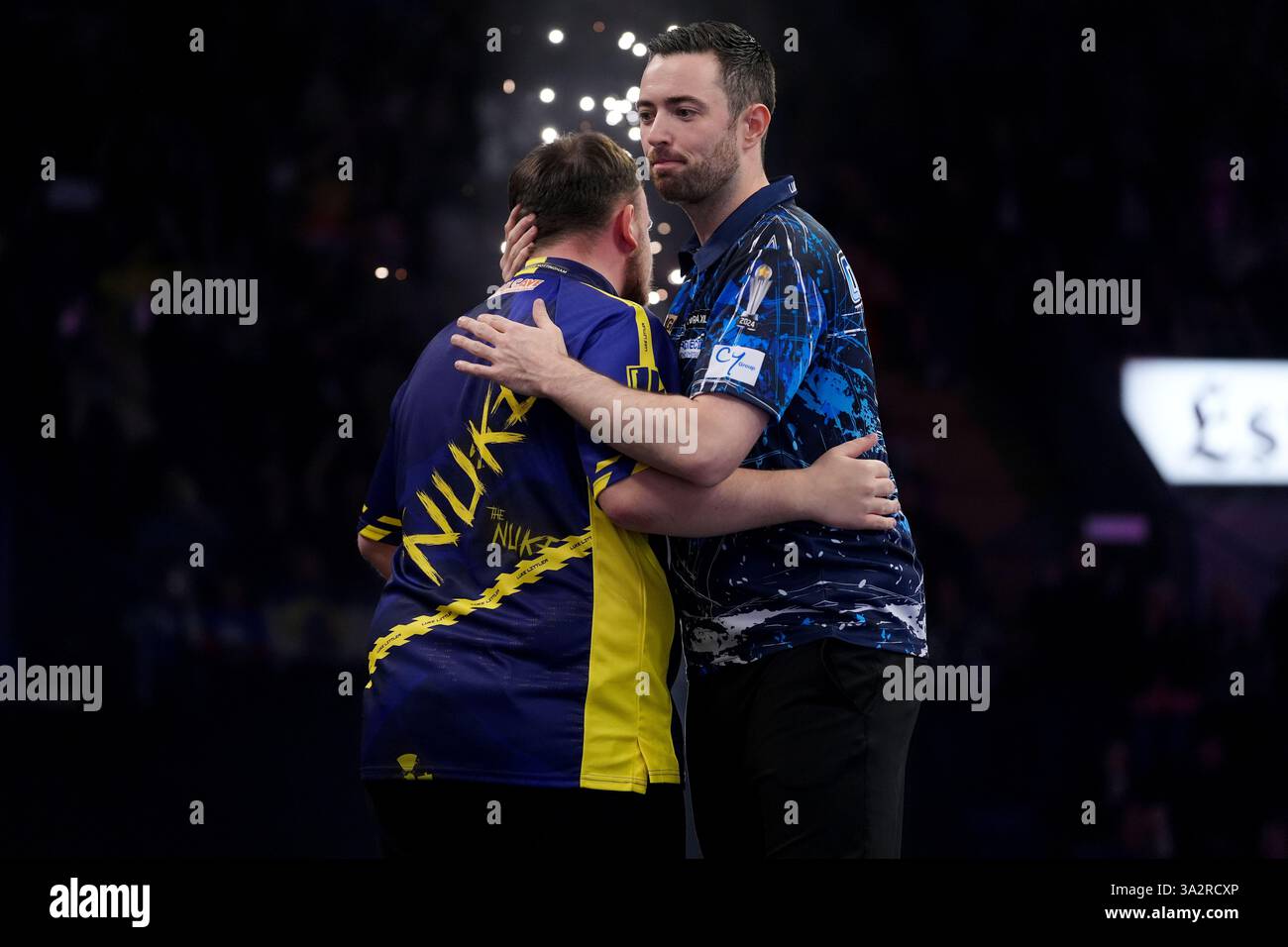Luke Littler and Luke Humphries embrace during night six of the BetMGM ...