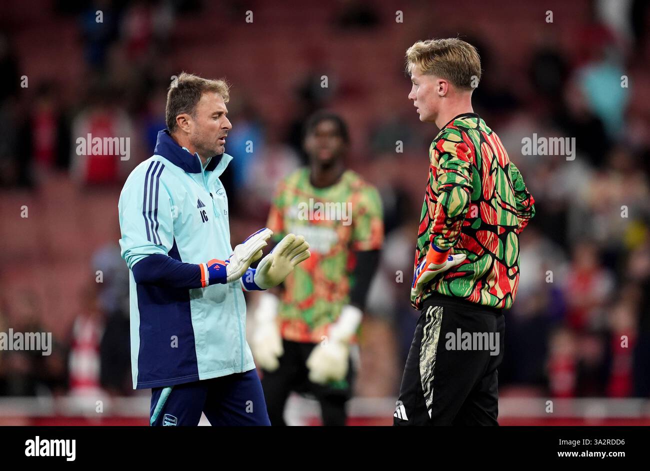 Arsenal's goalkeeper Jack Porter speaks to the goalkeeper coach Inaki ...