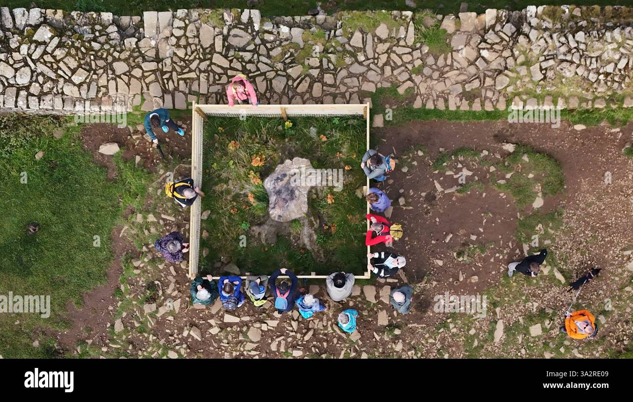 EMBARGOED TO 0001 FRIDAY SEPTEMBER 27 People gather around the stump of ...