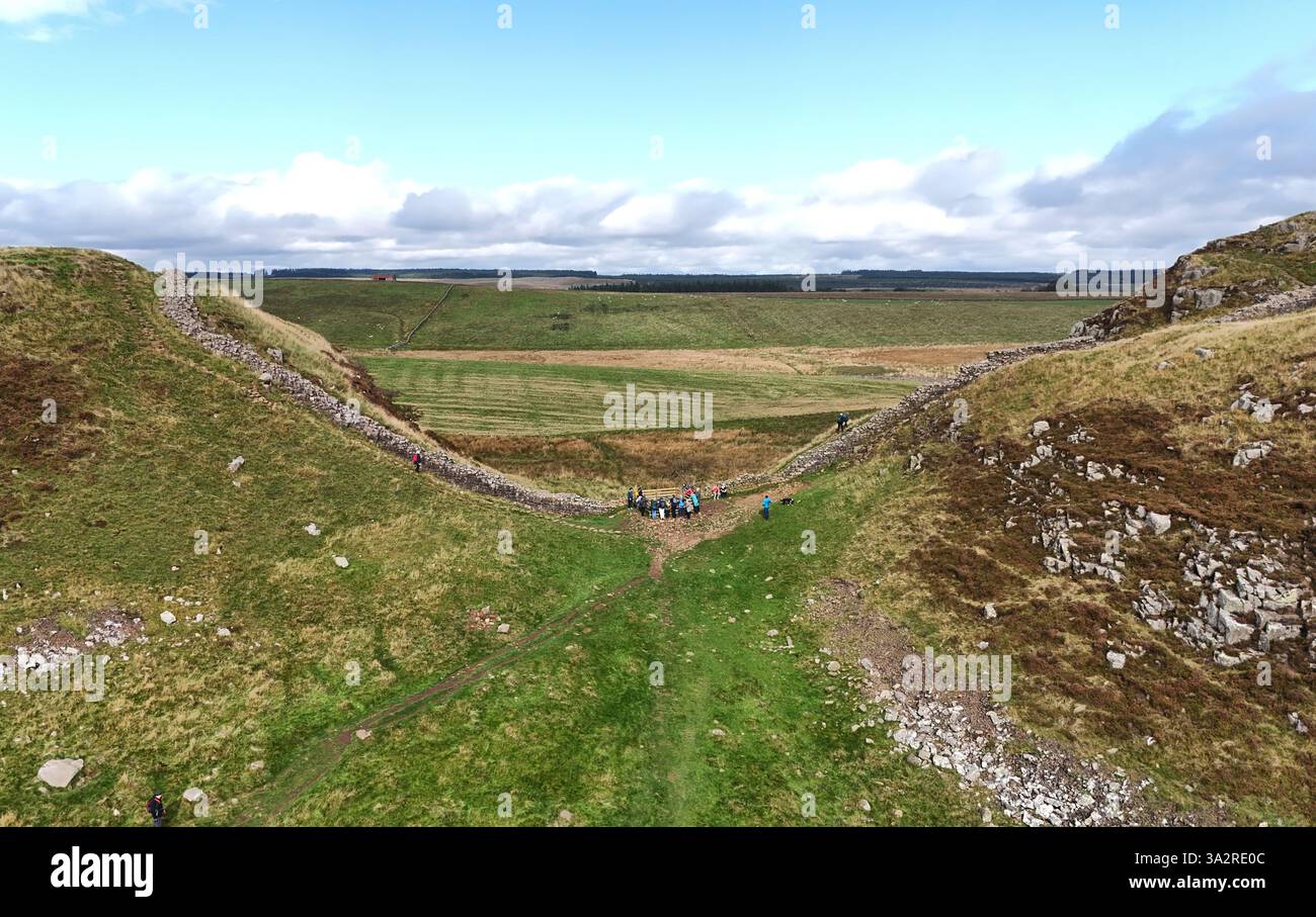 EMBARGOED TO 0001 FRIDAY SEPTEMBER 27 People gather around the stump of ...