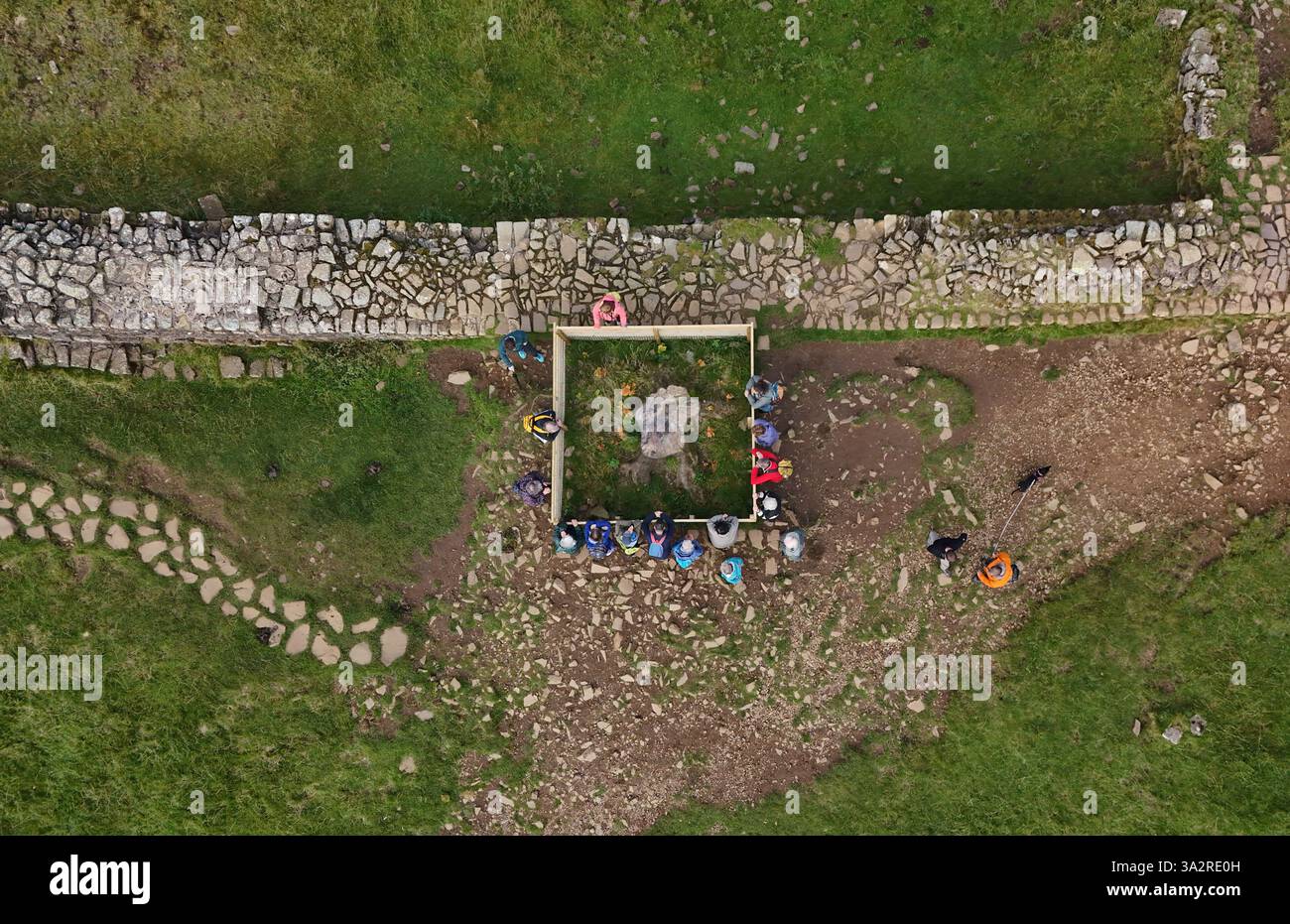 EMBARGOED TO 0001 FRIDAY SEPTEMBER 27 People gather around the stump of ...