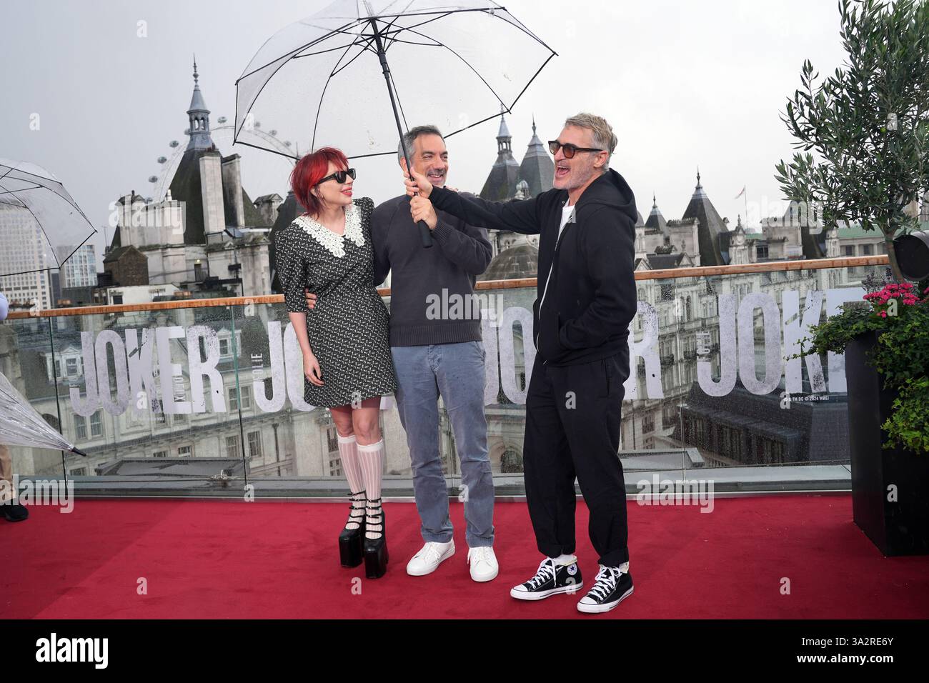 (Left to right) Lady Gaga, Todd Phillips and Joaquin Phoenix attending ...