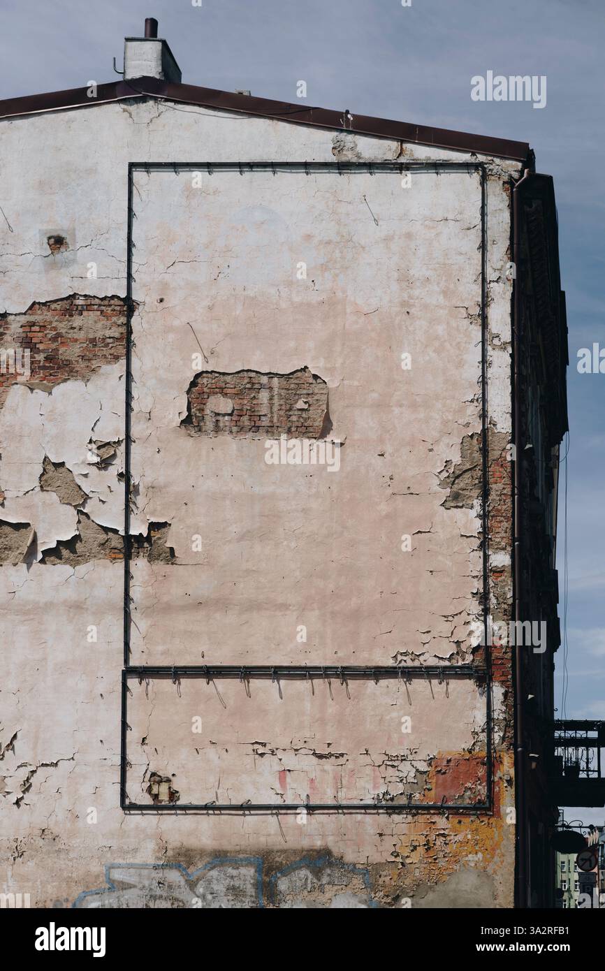 Facade of old and damaged building with falling off plaster Stock Photo ...
