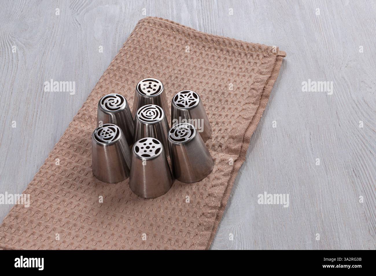 metal attachments for forming patterns from cream Stock Photo - Alamy