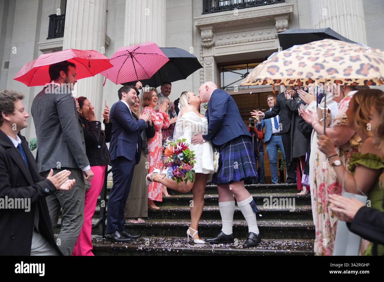 Newly married couple Thomas and Paige Mackintosh from Aberdeen, kiss on ...