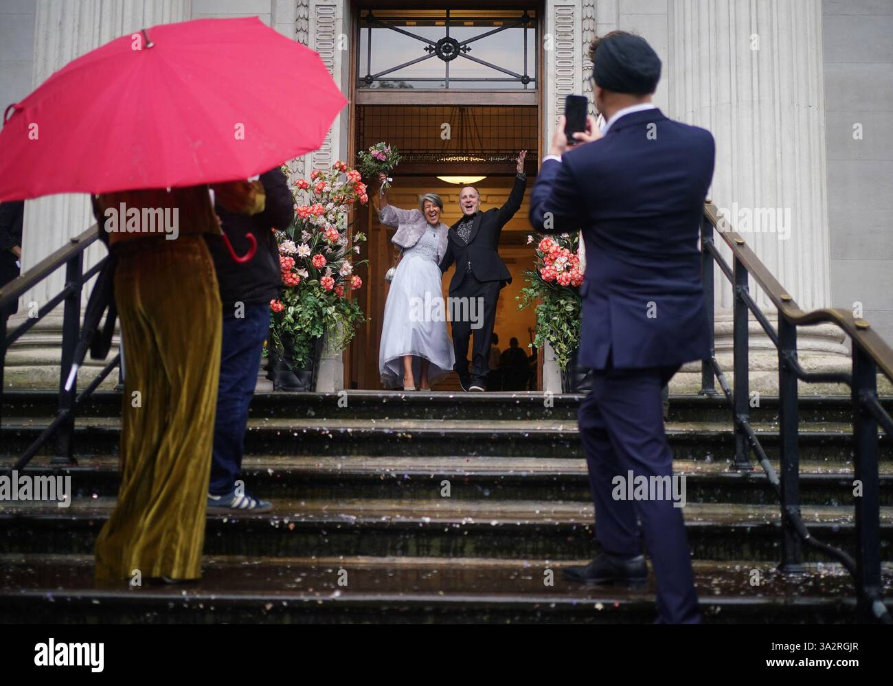 Ian Elliot, 54, and Paula Diaz, 50, following their civil partnership ...