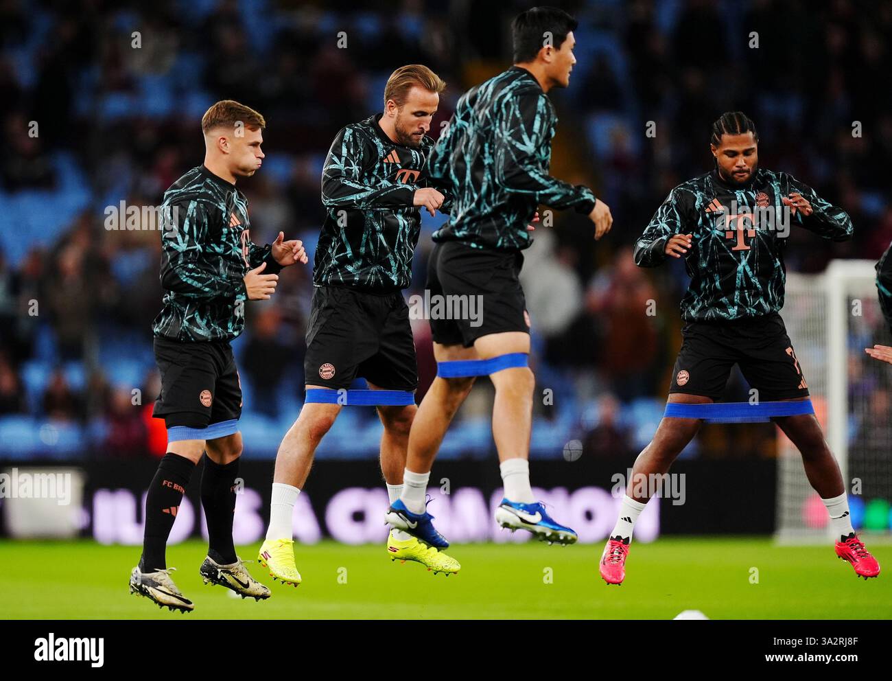 Bayern Munich's Harry Kane (centre left) warms up ahead of the UEFA ...