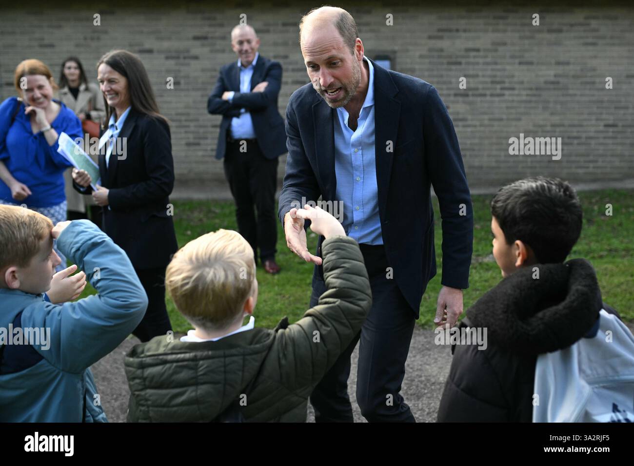 The Prince of Wales speaks with school children after a visit to ...