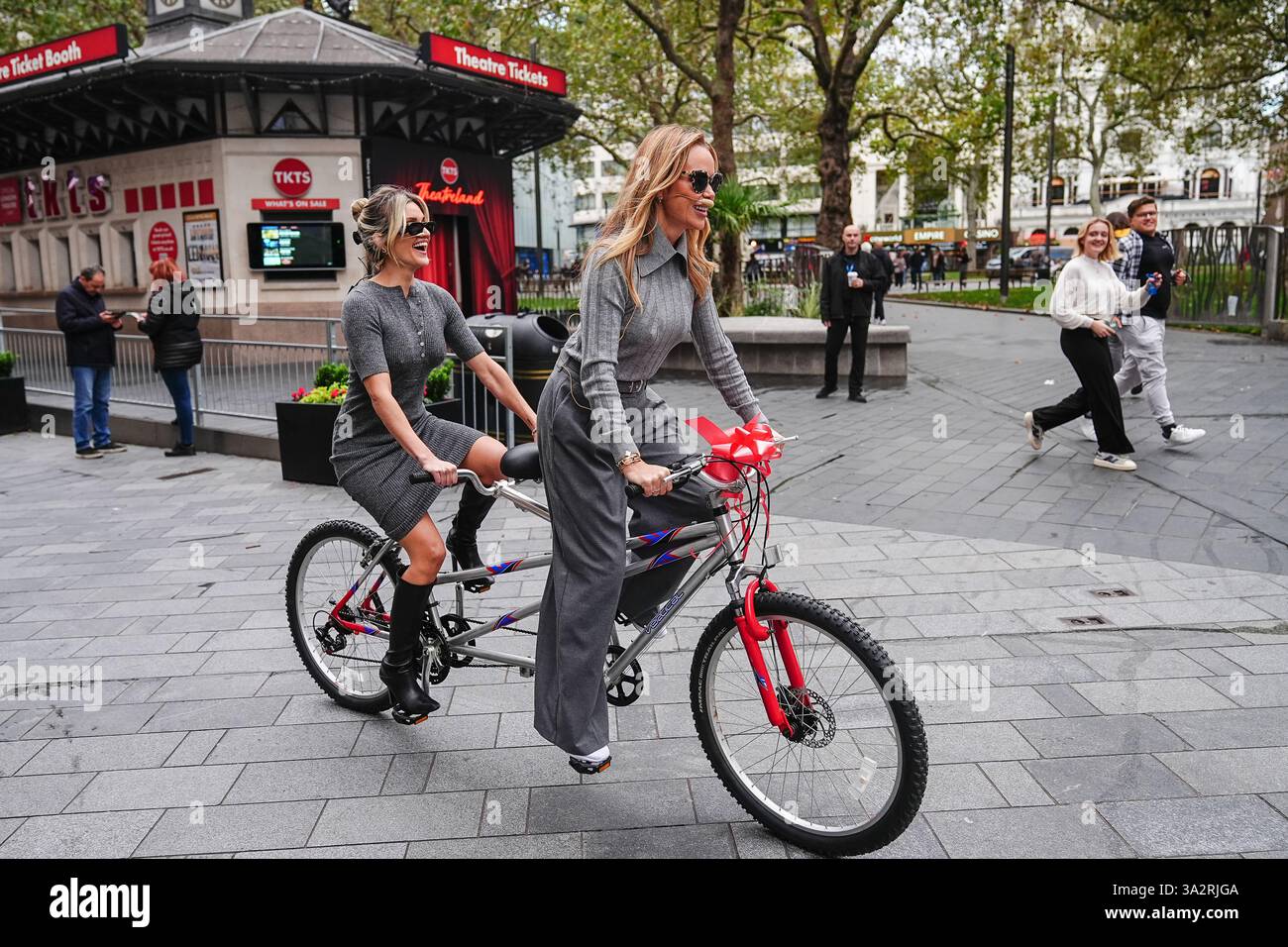 Amanda Holden and Ashley Roberts ride a tandem bike to launch Amanda ...