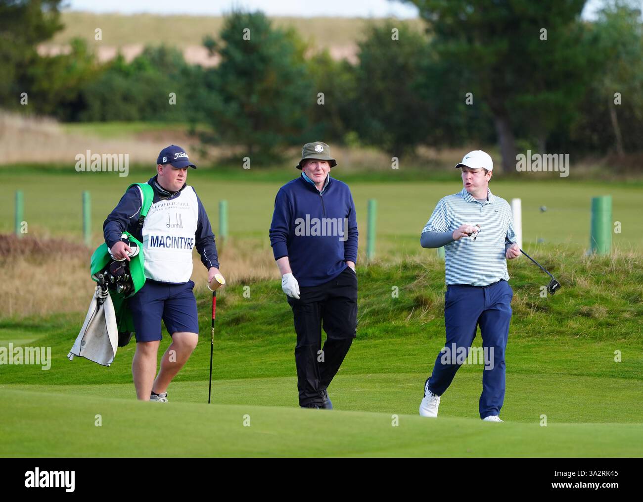 Dougie MacIntyre (centre) and Robert MacIntyre (right) on day one of ...