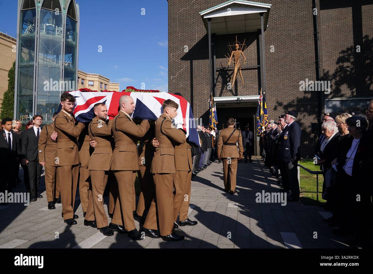 The coffin of 104-year-old D-Day veteran Don Sheppard is carried into ...