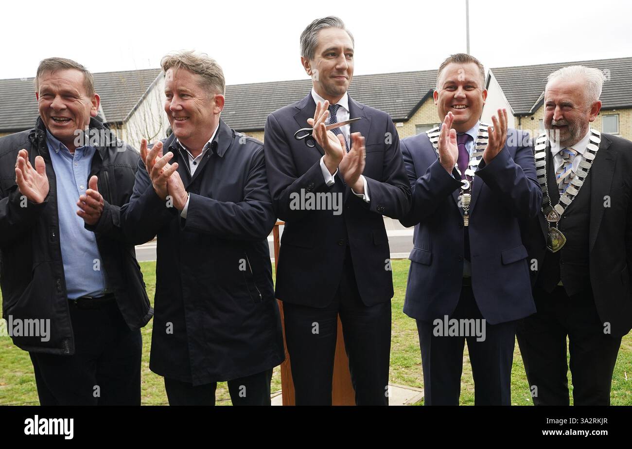 Taoiseach Simon Harris (centre), Minister for Housing Darragh O'Brien ...