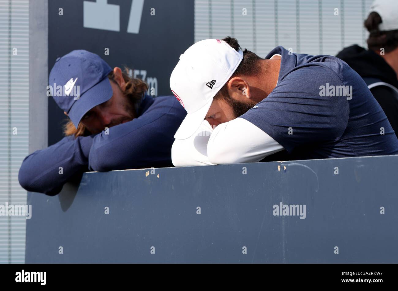 Tommy Fleetwood (left) and Jon Rahm on the seventeenth during day three ...