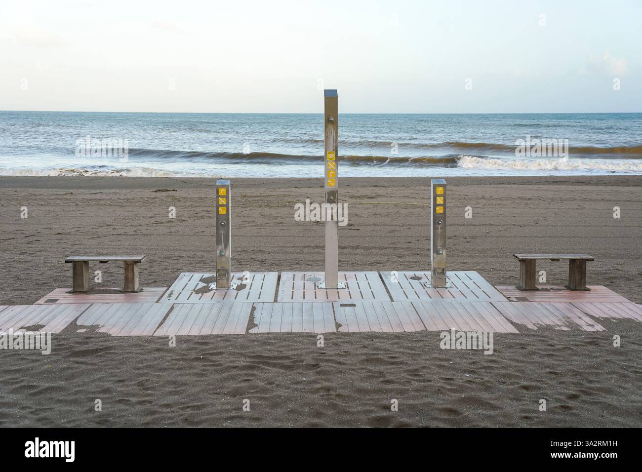 A modern foot shower and body shower on the beach of Fuengirola. Costa ...