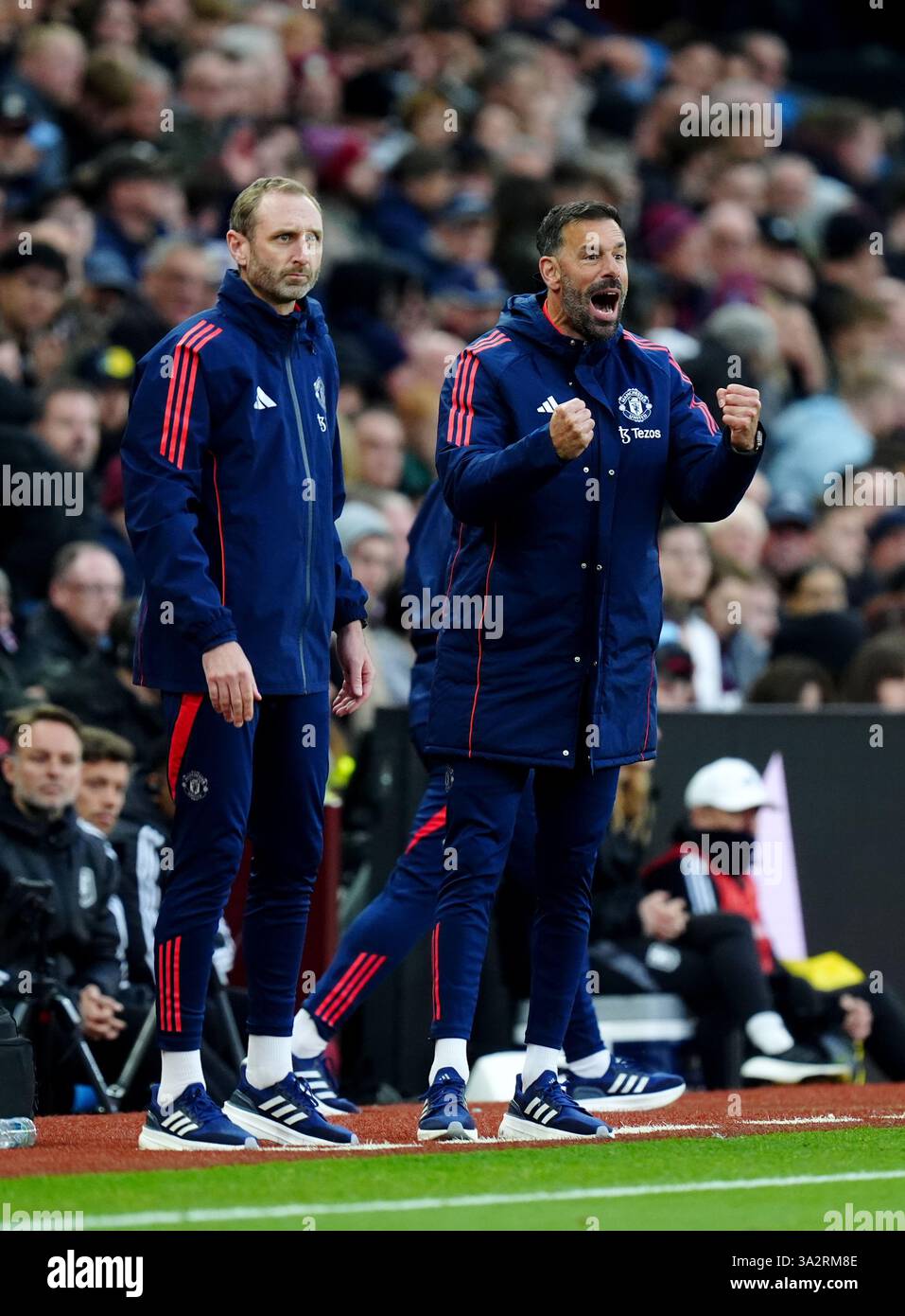 Manchester United assistant manager Ruud van Nistelrooy (right) during ...