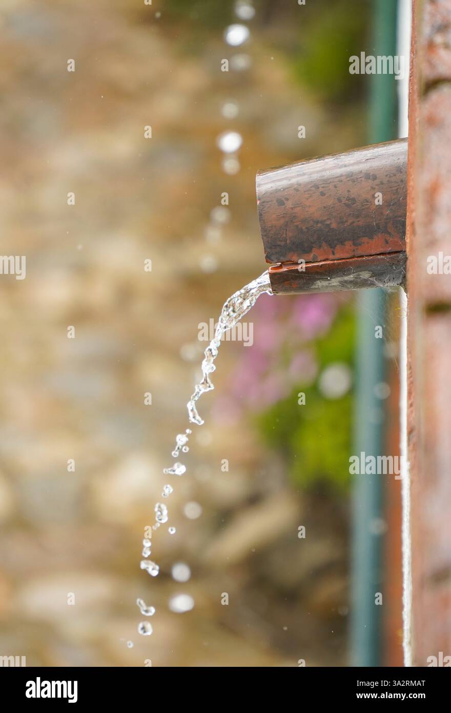Water Spout Pouring from Balcony with flowing stream during rainfall ...