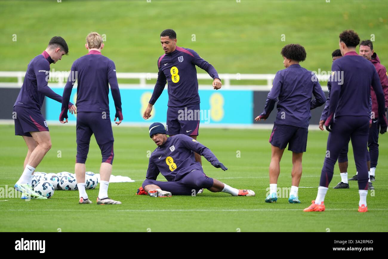 England's Jude Bellingham on the ground during a training session at St ...